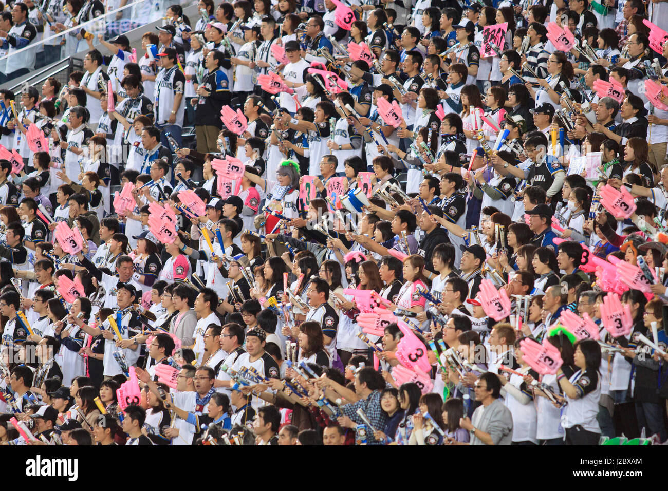 A giant crowd of people at the Sapporo Dome in Sapporo, Hokkaido gather ...