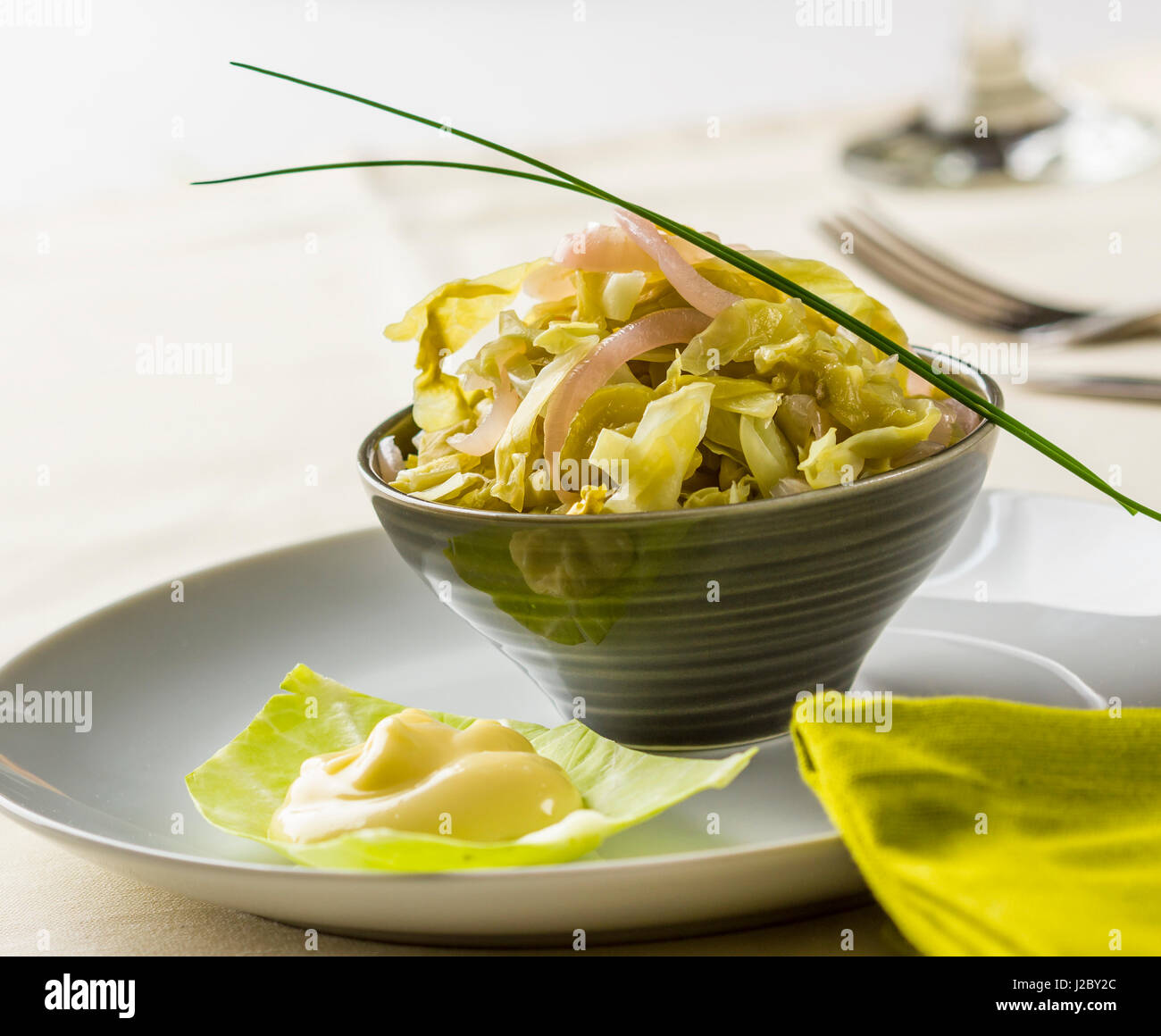 Raw collard greens salad served with mayonnaise Stock Photo - Alamy