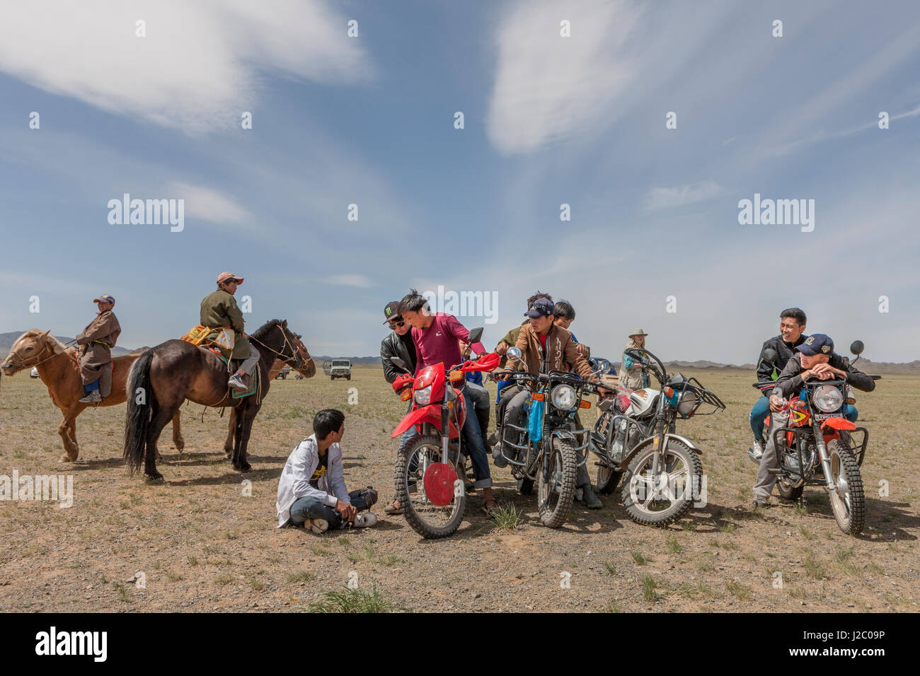 Motorcycles, Horses and a car. Desert Transportation. Gobi Desert ...