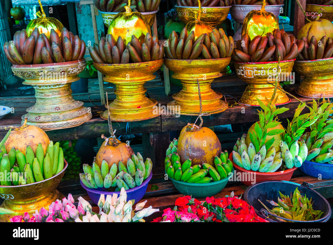 Myanmar. Yangon. Botataung Pagoda. Offerings of bananas and cocoanuts ...