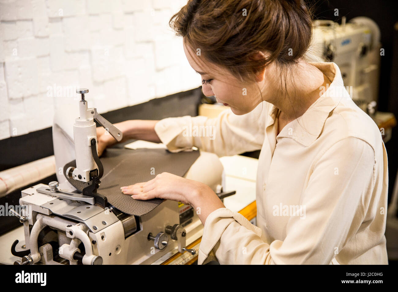 Female designer making a bag Stock Photo - Alamy