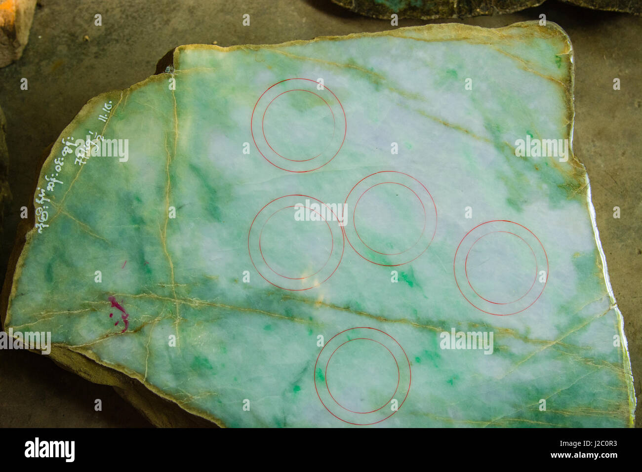 Myanmar. Mandalay. Jade market. Huge jade boulder with notes on good ...
