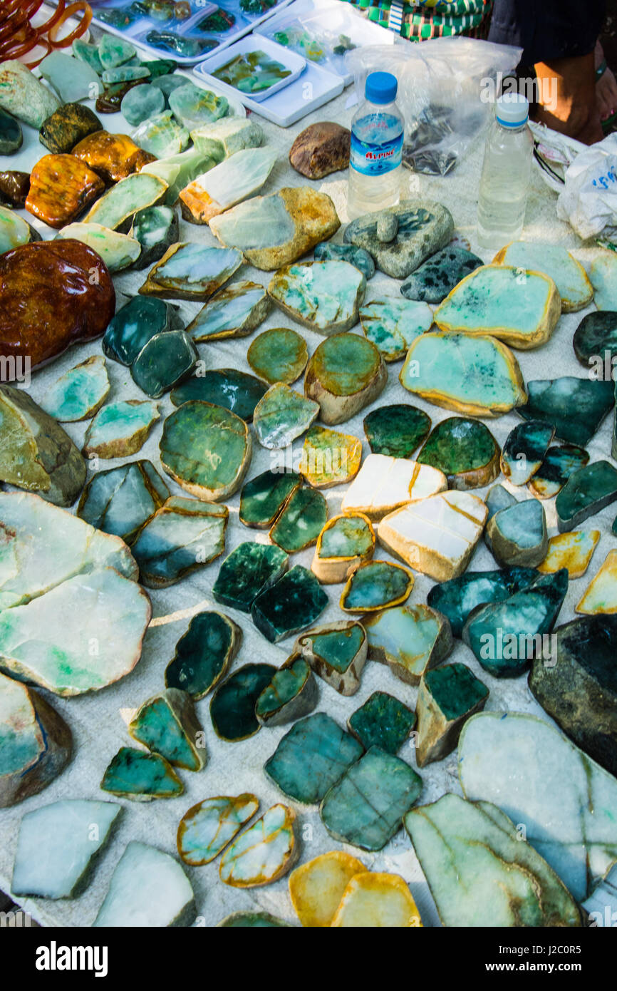 Myanmar. Mandalay. Jade market. Jade rocks cut open to reveal color ...