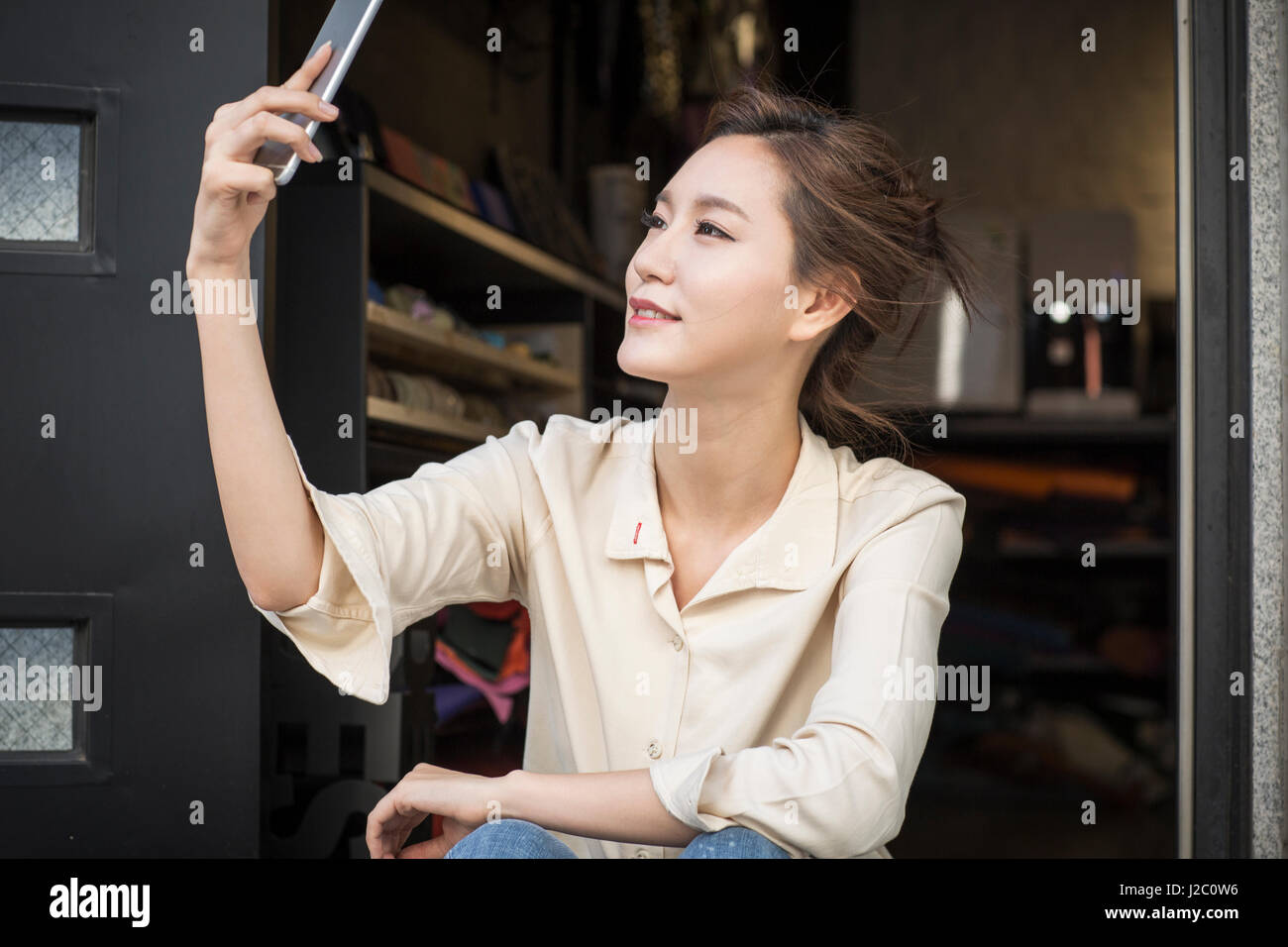 Female shopkeeper hi-res stock photography and images - Alamy