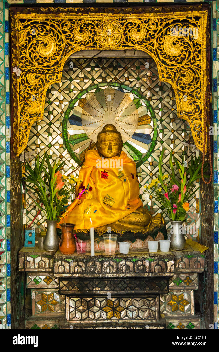Myanmar. Yangon. Botataung Pagoda. Small golden Buddha in a niche Stock ...