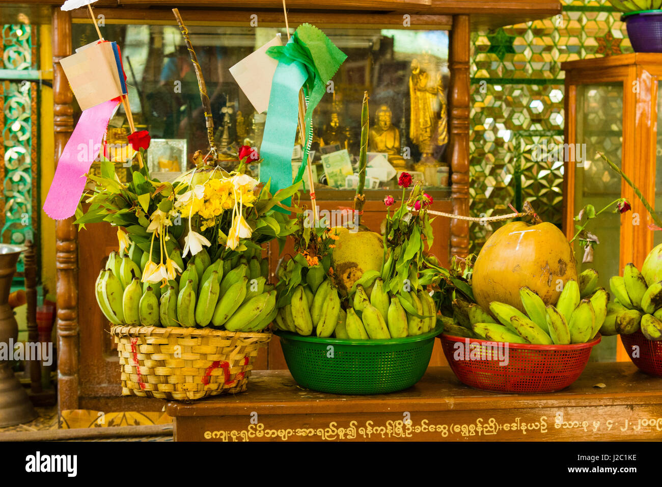 Myanmar. Yangon. Botataung Pagoda. Offerings of bananas and cocoanuts ...