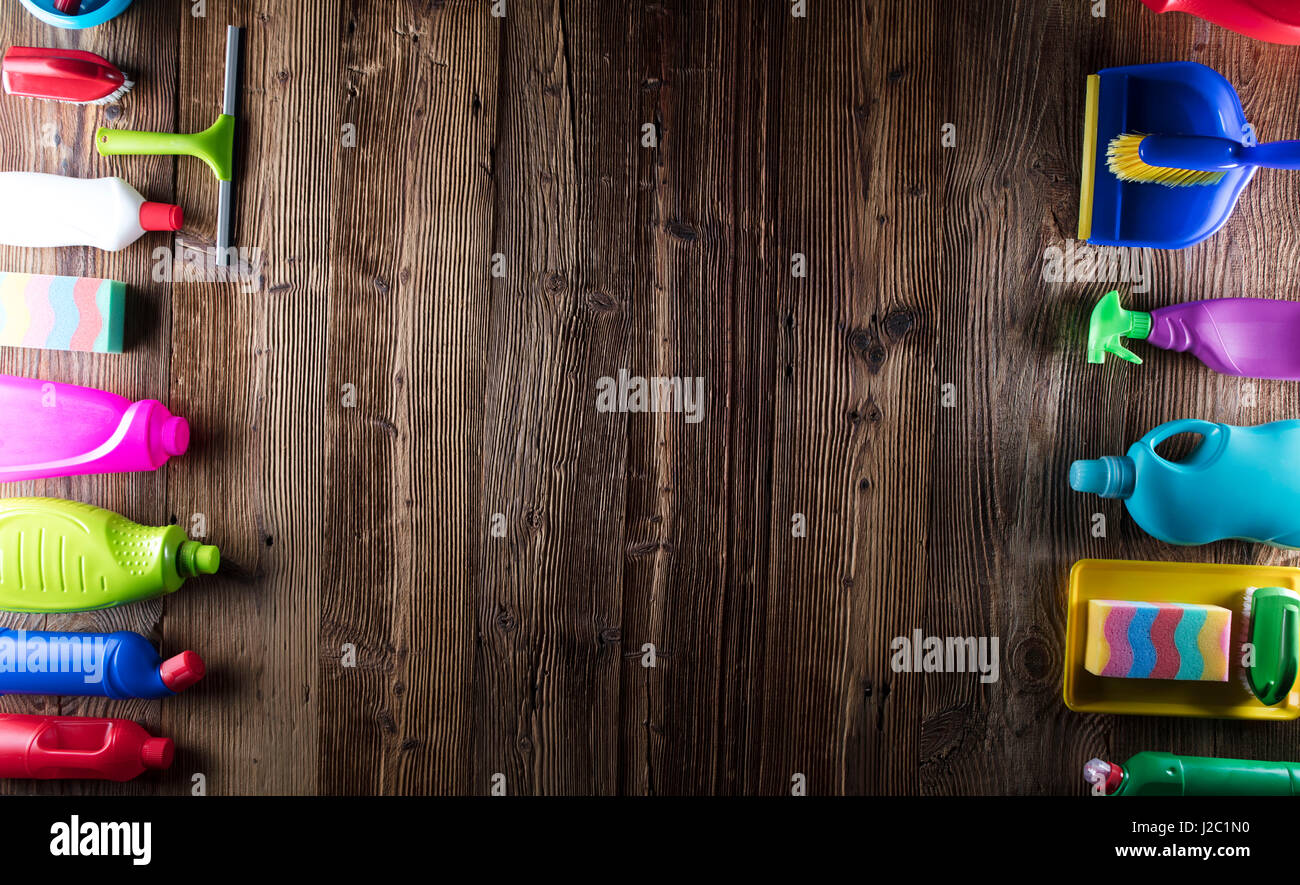 Spring cleanup theme. Variety of colorful house cleaning products on a ...