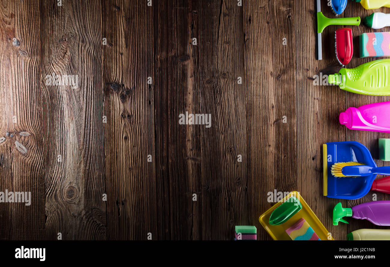 Spring cleanup theme. Variety of colorful house cleaning products on a ...