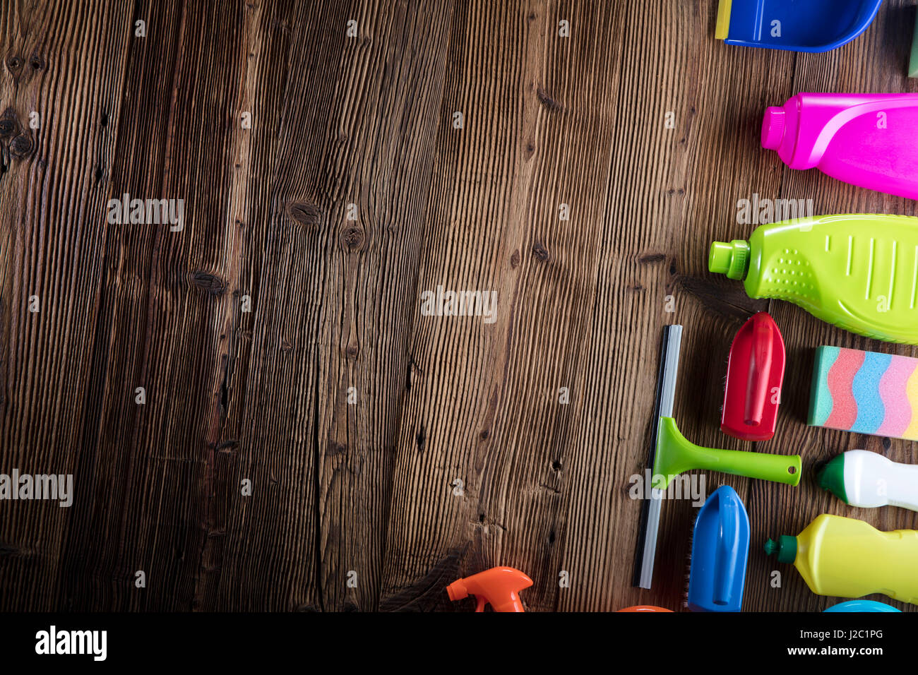 Spring cleanup theme. Variety of colorful house cleaning products on a ...