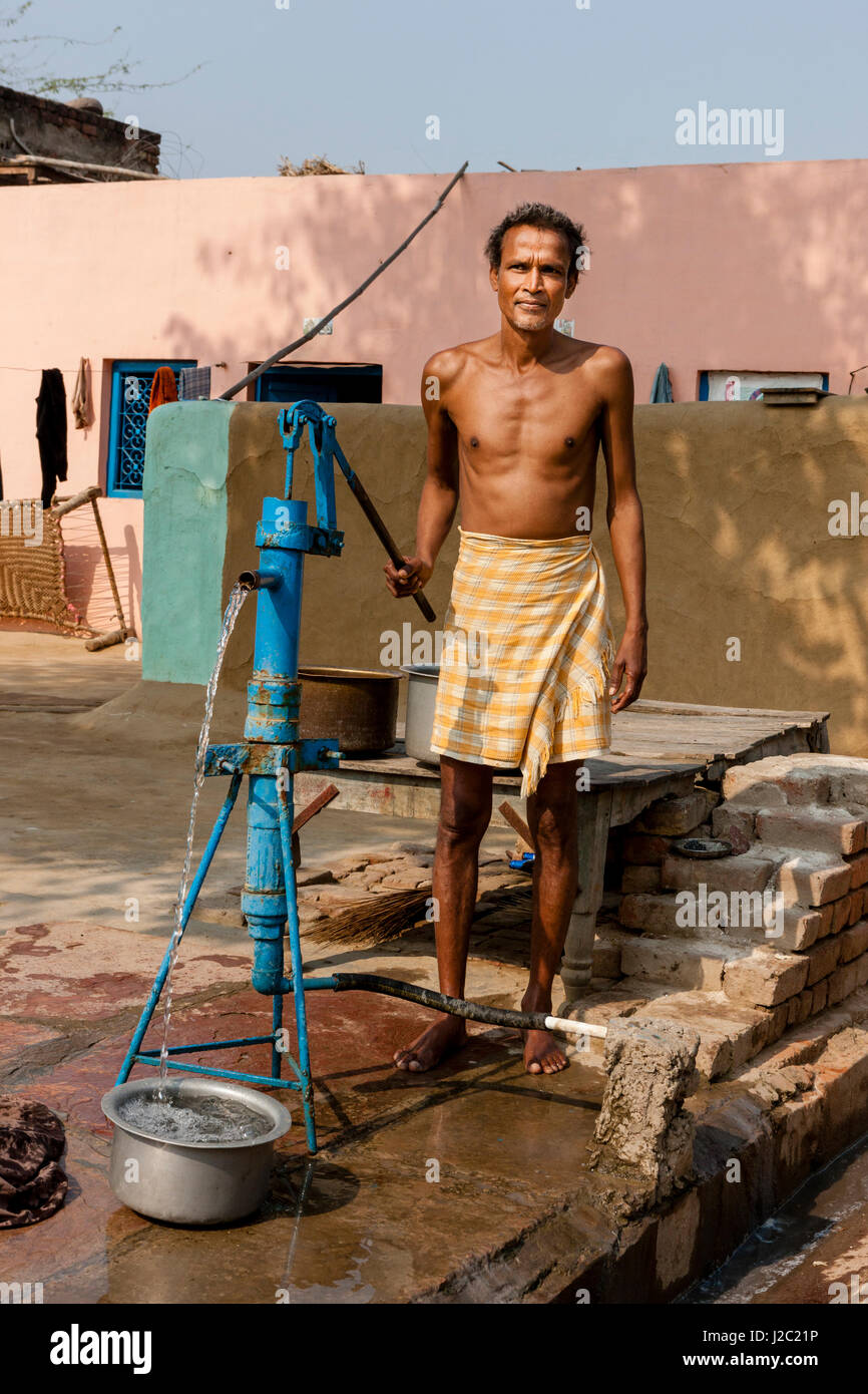 Man pumping water. Fatehpur Sikri village. Bharatpur. Rajasthan. India ...