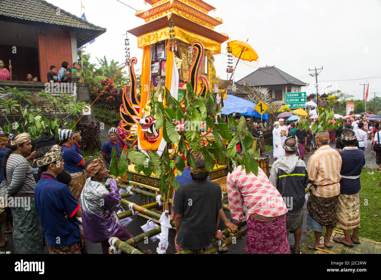 Indonesia, Bali. Funeral shrine procession. The family members place ...