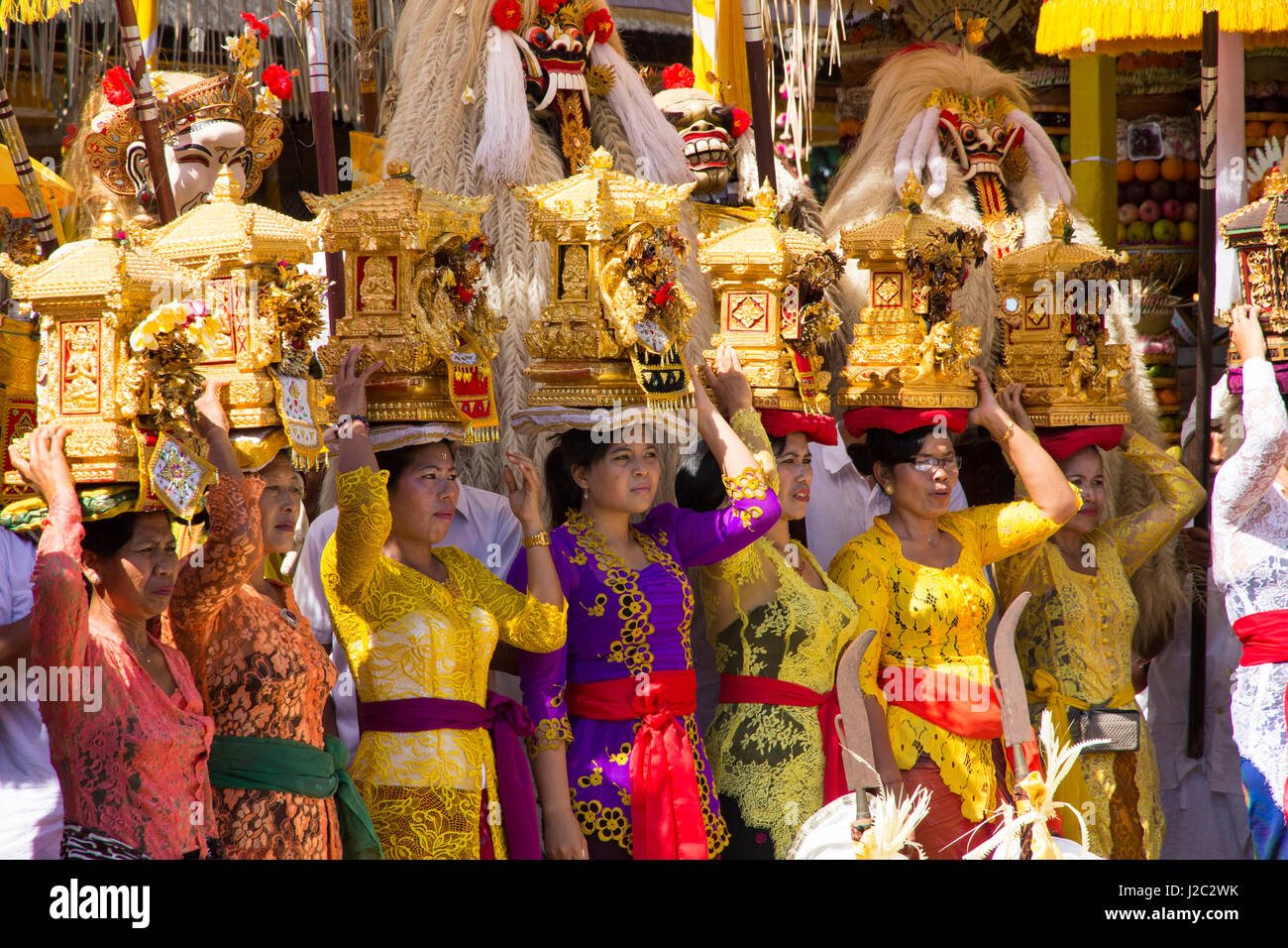 Indonesia, Bali. Participants in the Hindu Temple festival enter the ...