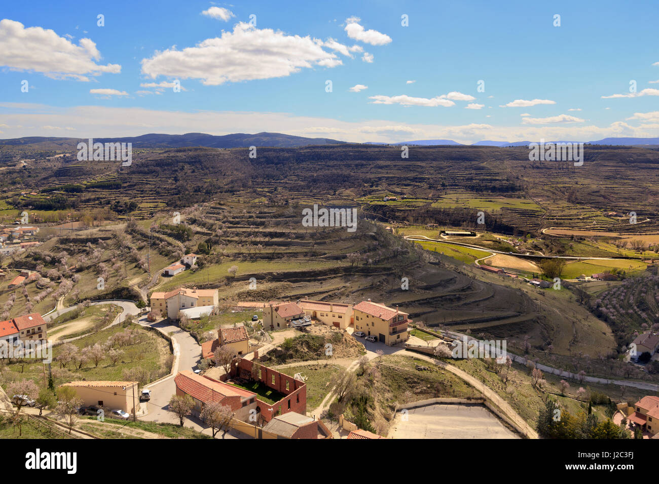 View over the valley below the walled city of Morella Spain Stock Photo ...