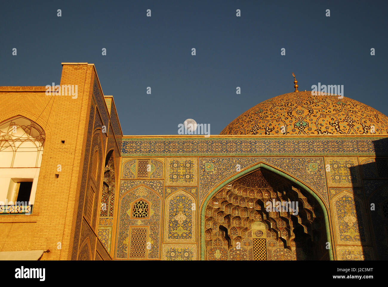 Iran, Isfahan, moonrise over Imam Square and Sheikh Lotfallah mosque ...