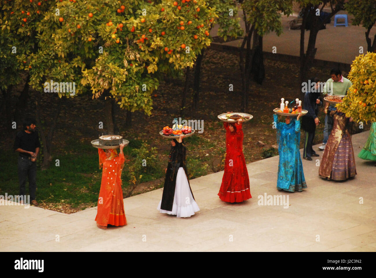Women in traditional dress brining hi-res stock photography and images ...