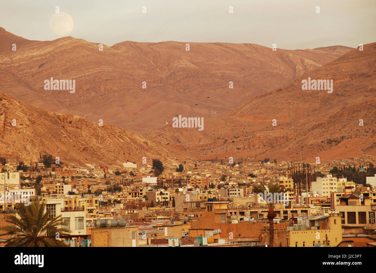 Iran, Shiraz, giant moonrise of dry mountain and city Stock Photo - Alamy