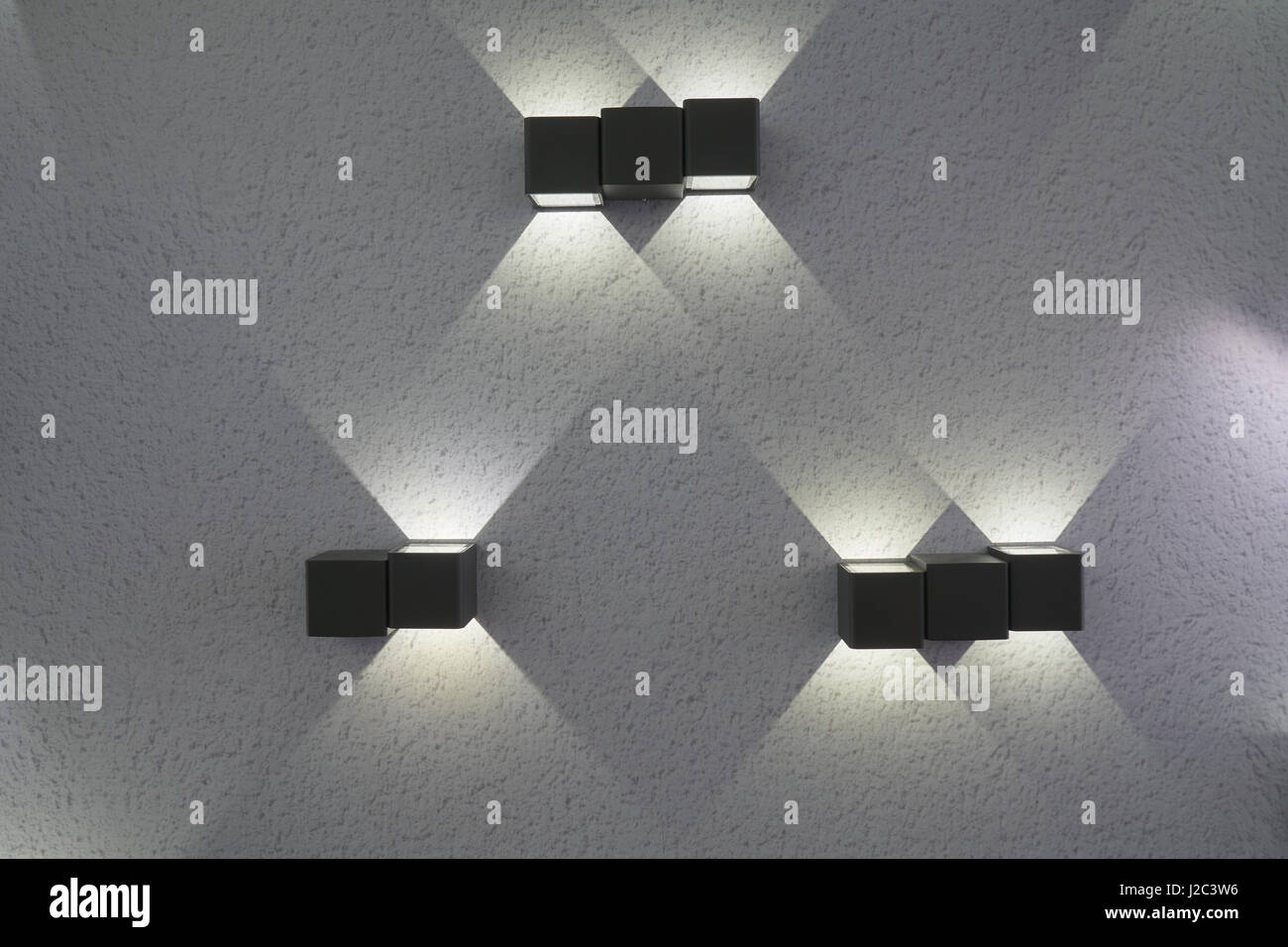 Electric lamps mounted on the wall of the house Stock Photo - Alamy