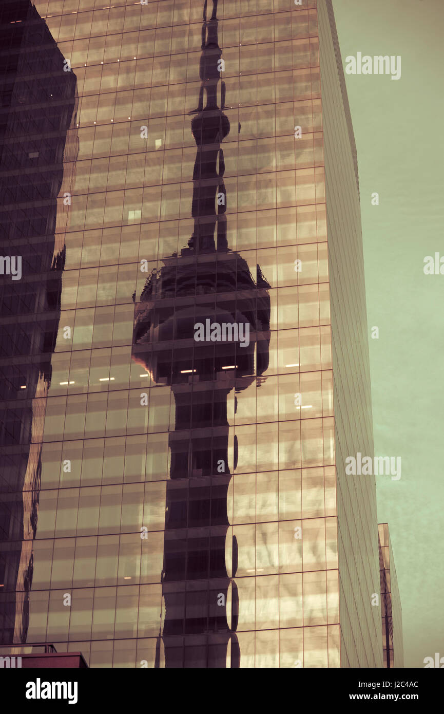 CN tower reflection on the glass wall of an office building Stock Photo ...