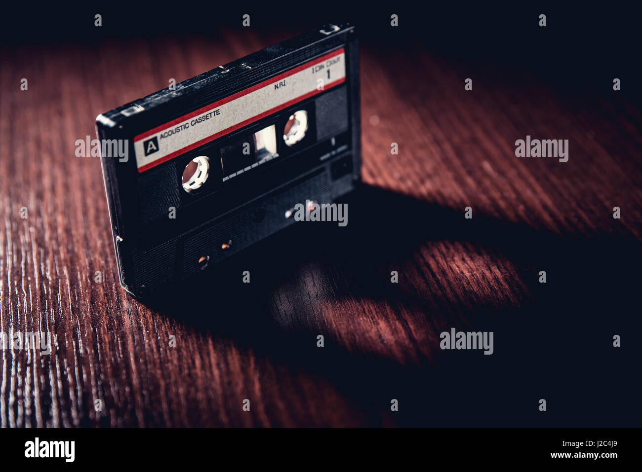 Old-fashioned cassette tape on the dark surface Stock Photo - Alamy