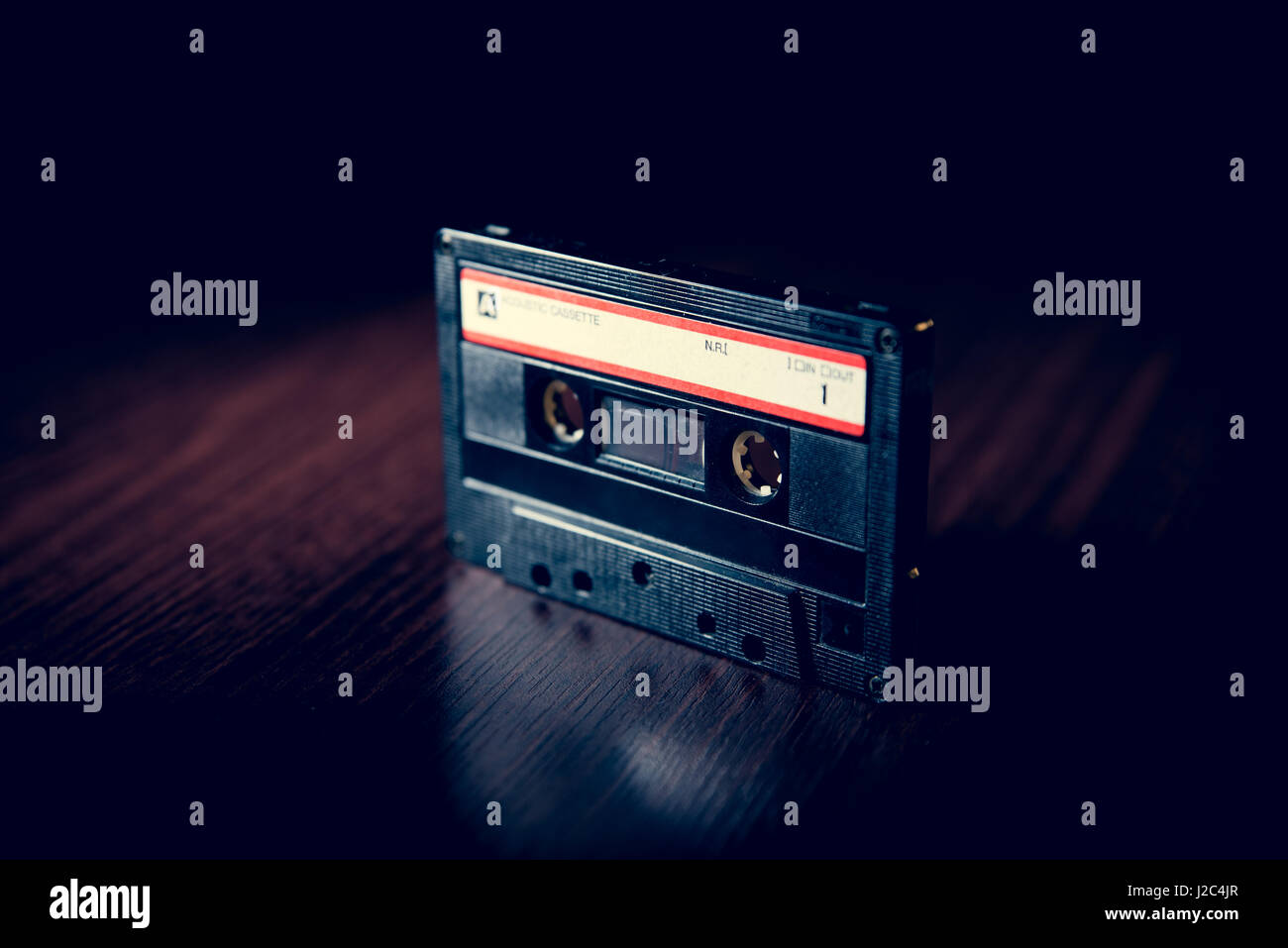 Old-fashioned cassette tape on the dark surface Stock Photo - Alamy