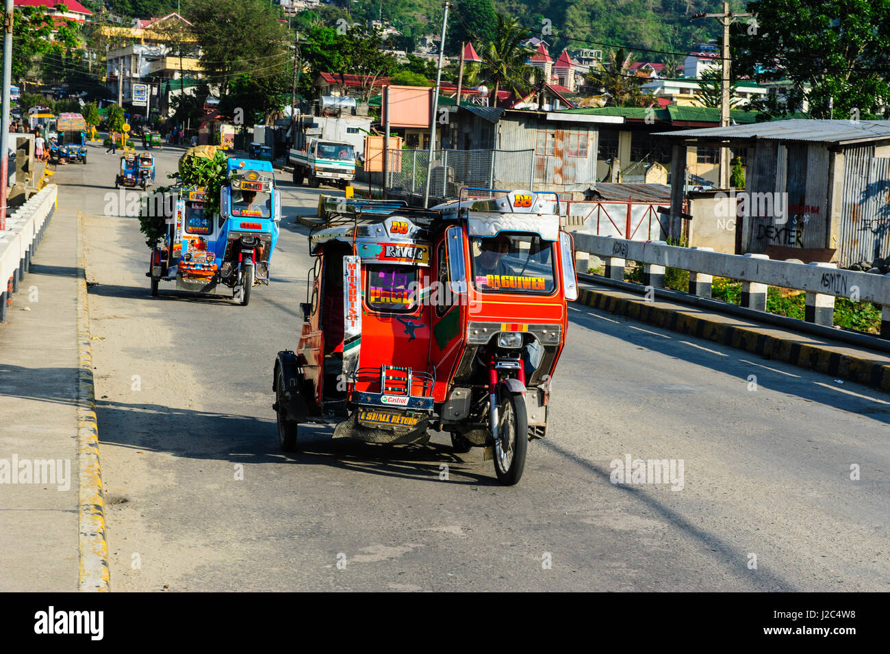 Moto rickshaw driving through Bontoc, Luzon, Philippines Stock Photo ...