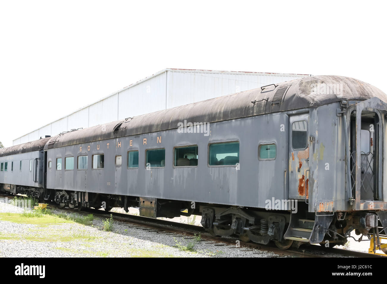 An old abandoned railroad train on tracks Stock Photo - Alamy