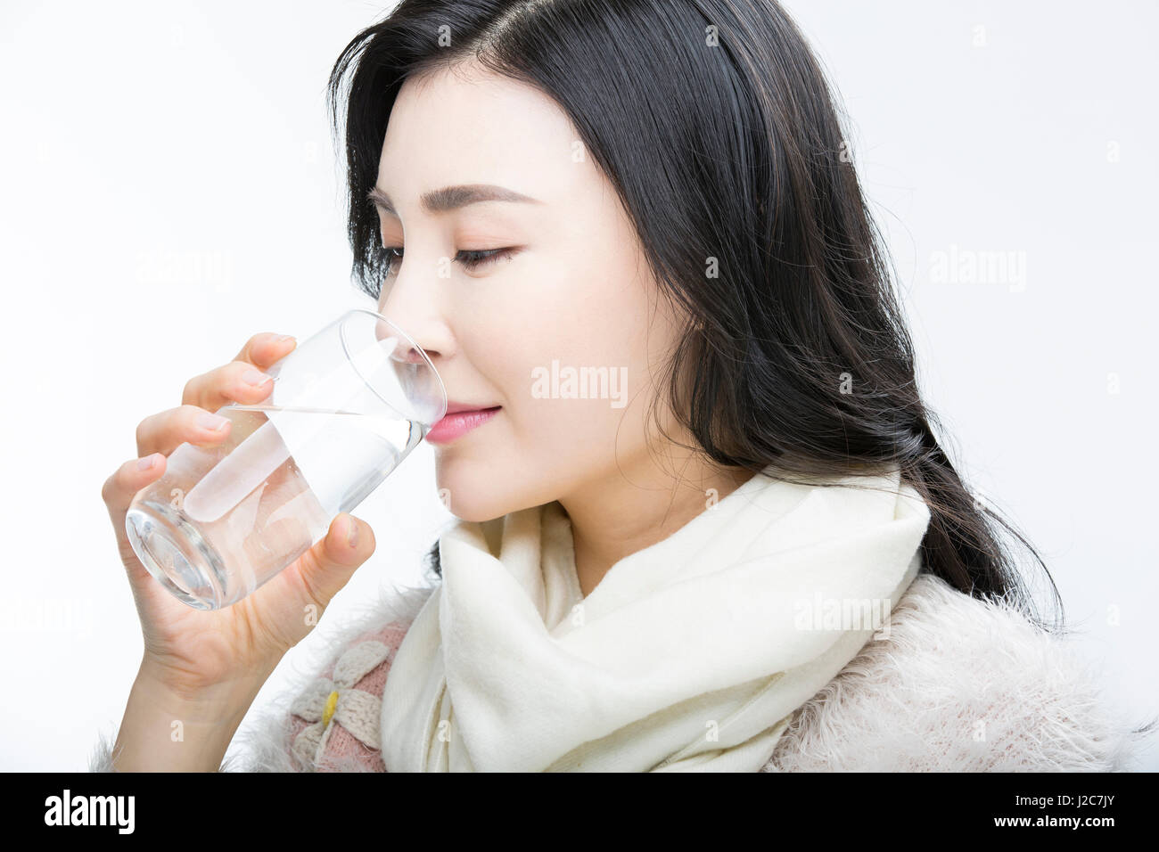 Young woman drinking water Stock Photo - Alamy