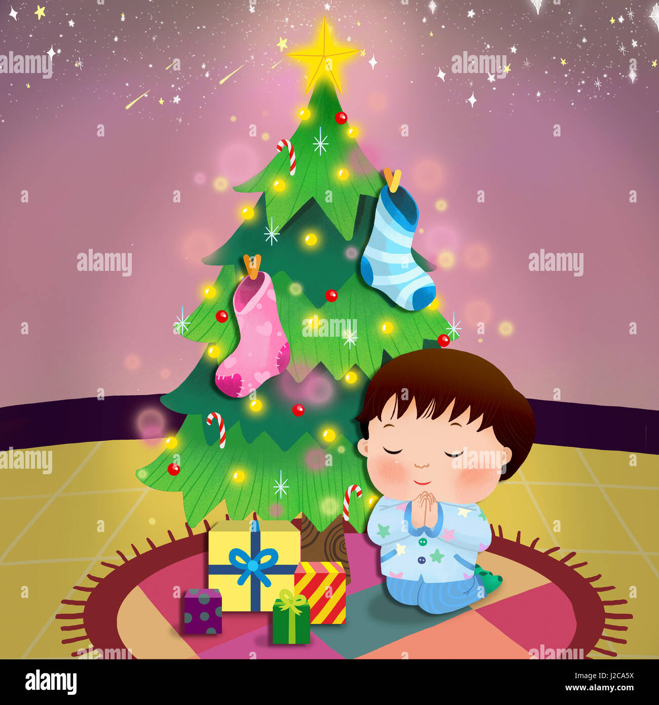 Cute boy praying on Christmas Day Stock Photo - Alamy