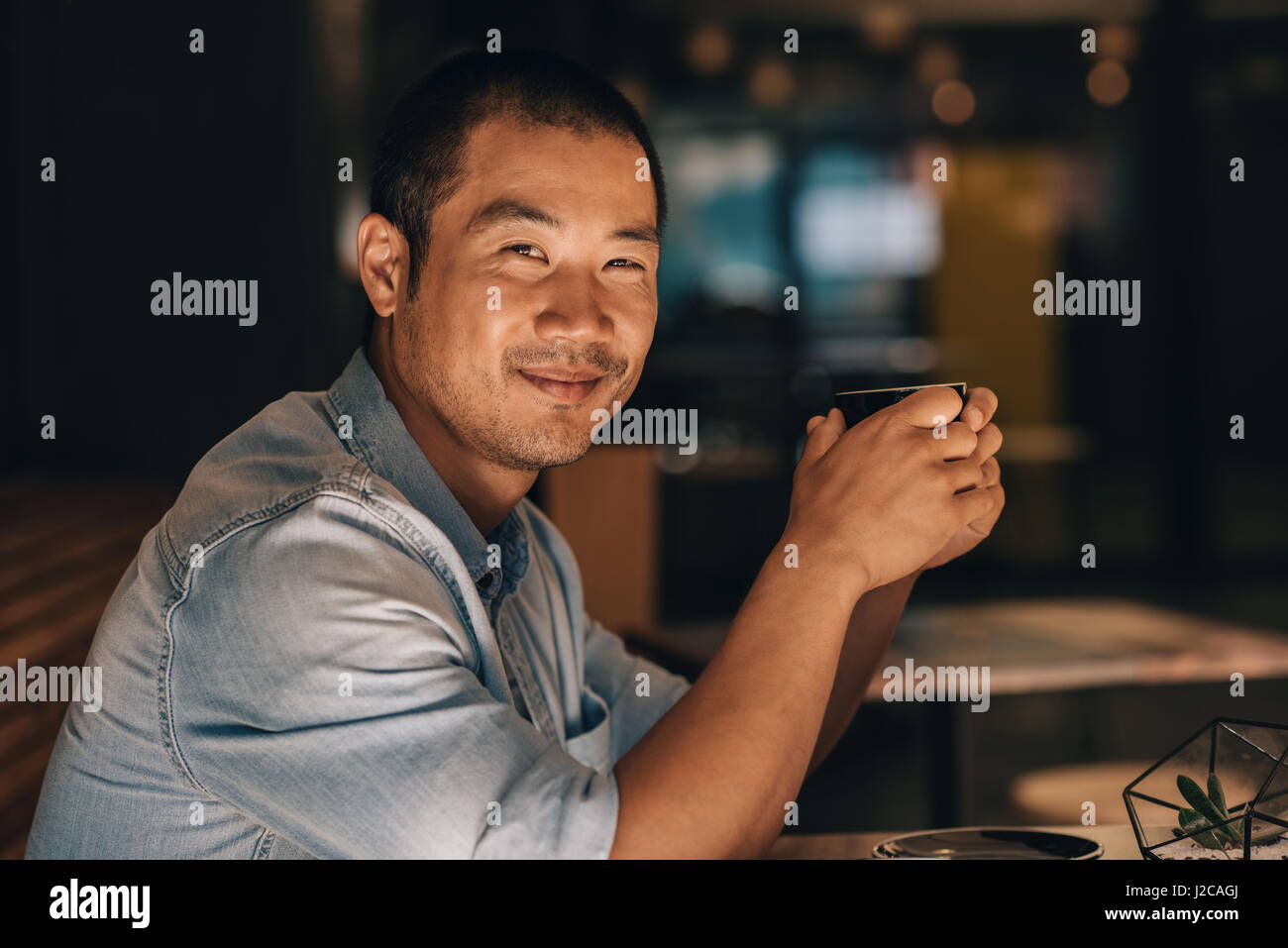 Asian man sitting in coffee hi-res stock photography and images - Alamy