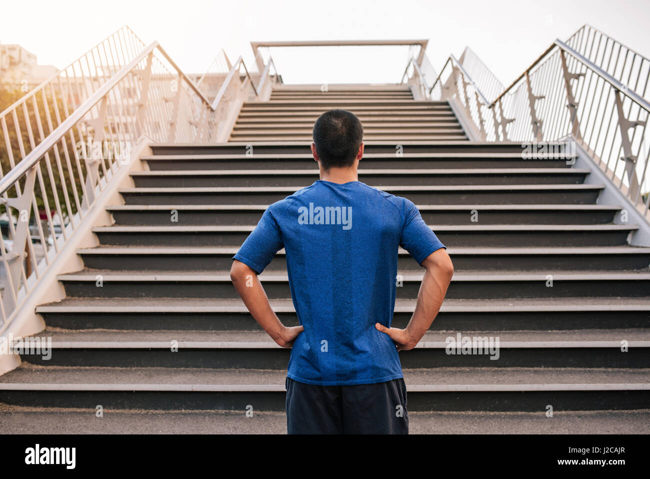 Young athletic runner preparing to run up steep stairs Stock Photo - Alamy