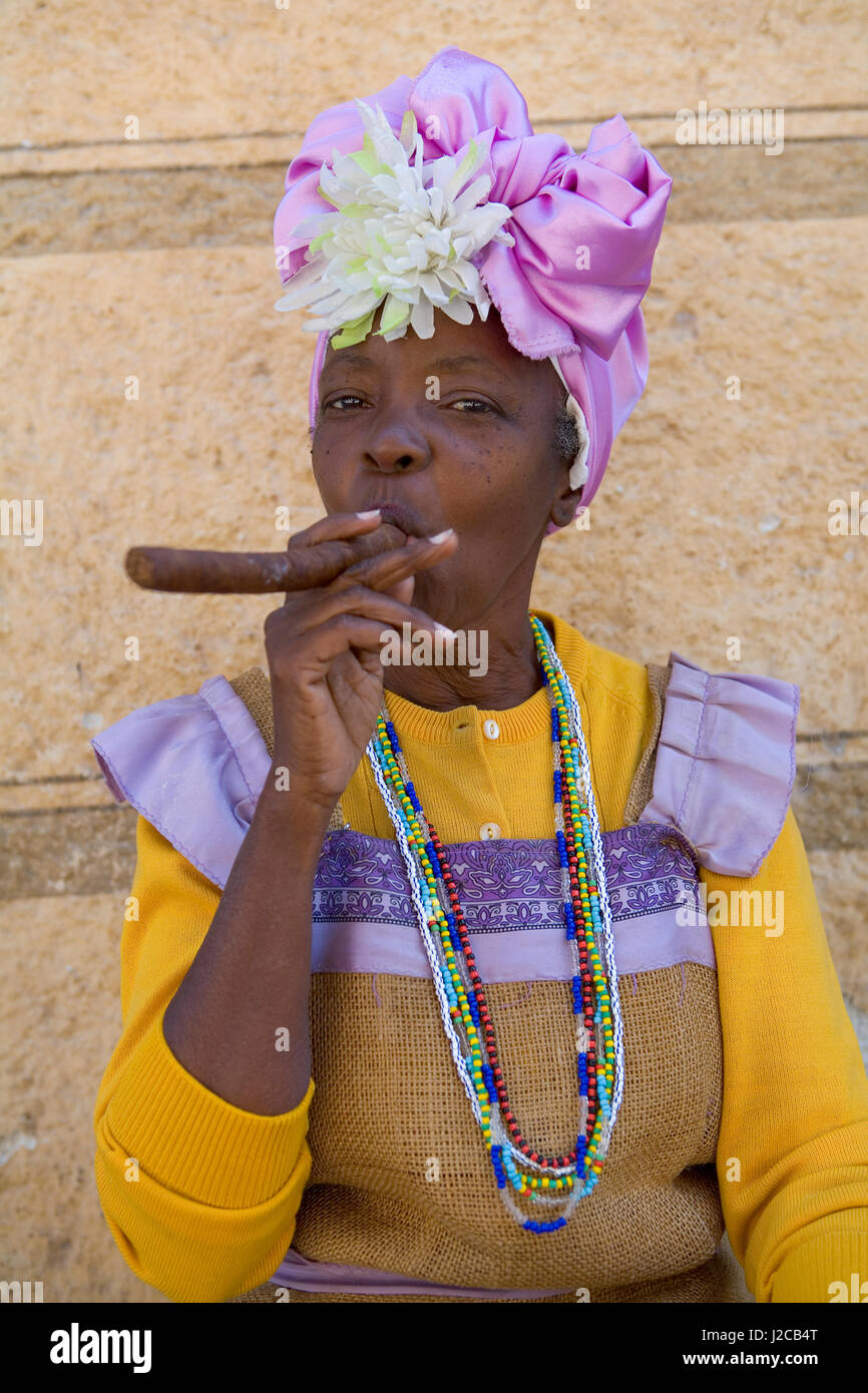 Cuban woman smoking a cigar, Havana, Cuba Stock Photo - Alamy