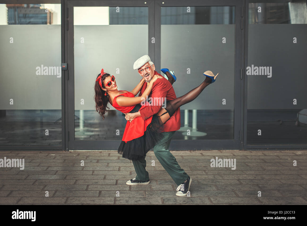 Old man dancing with a young woman fast dance Stock Photo - Alamy