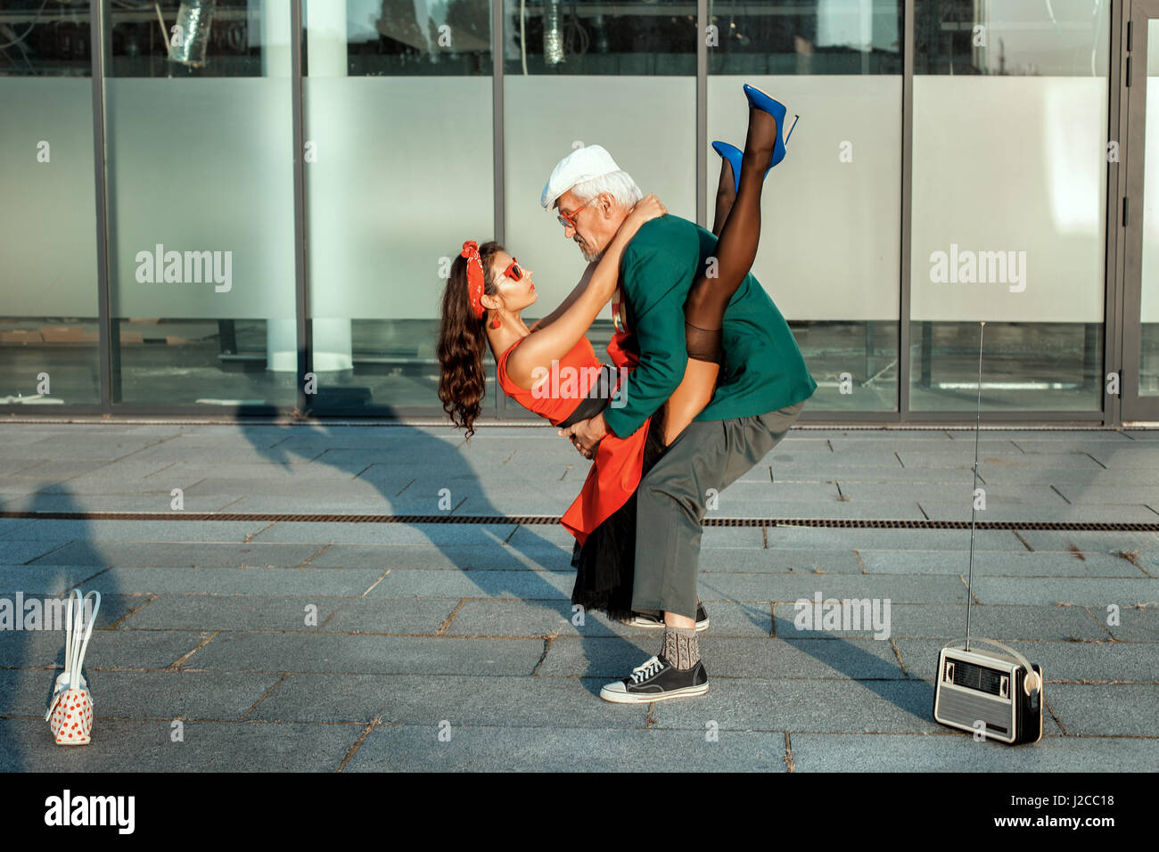 Old man dancing with a young girl in retro style Stock Photo - Alamy