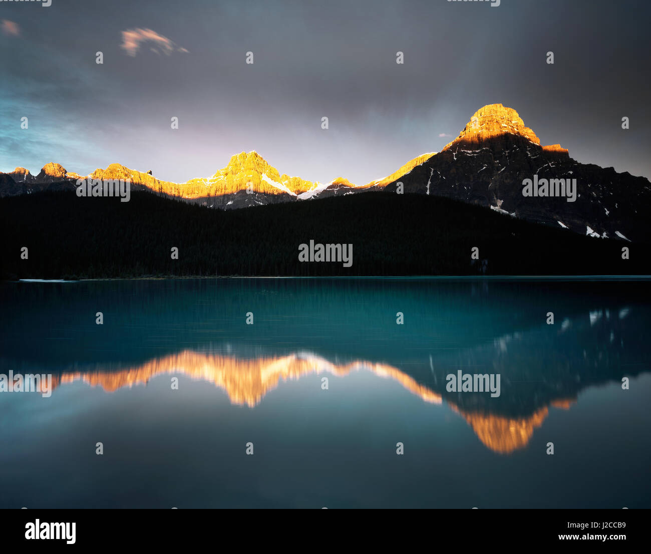 Canada, Alberta, Banff National Park, Mount Chephren reflects in a lake ...