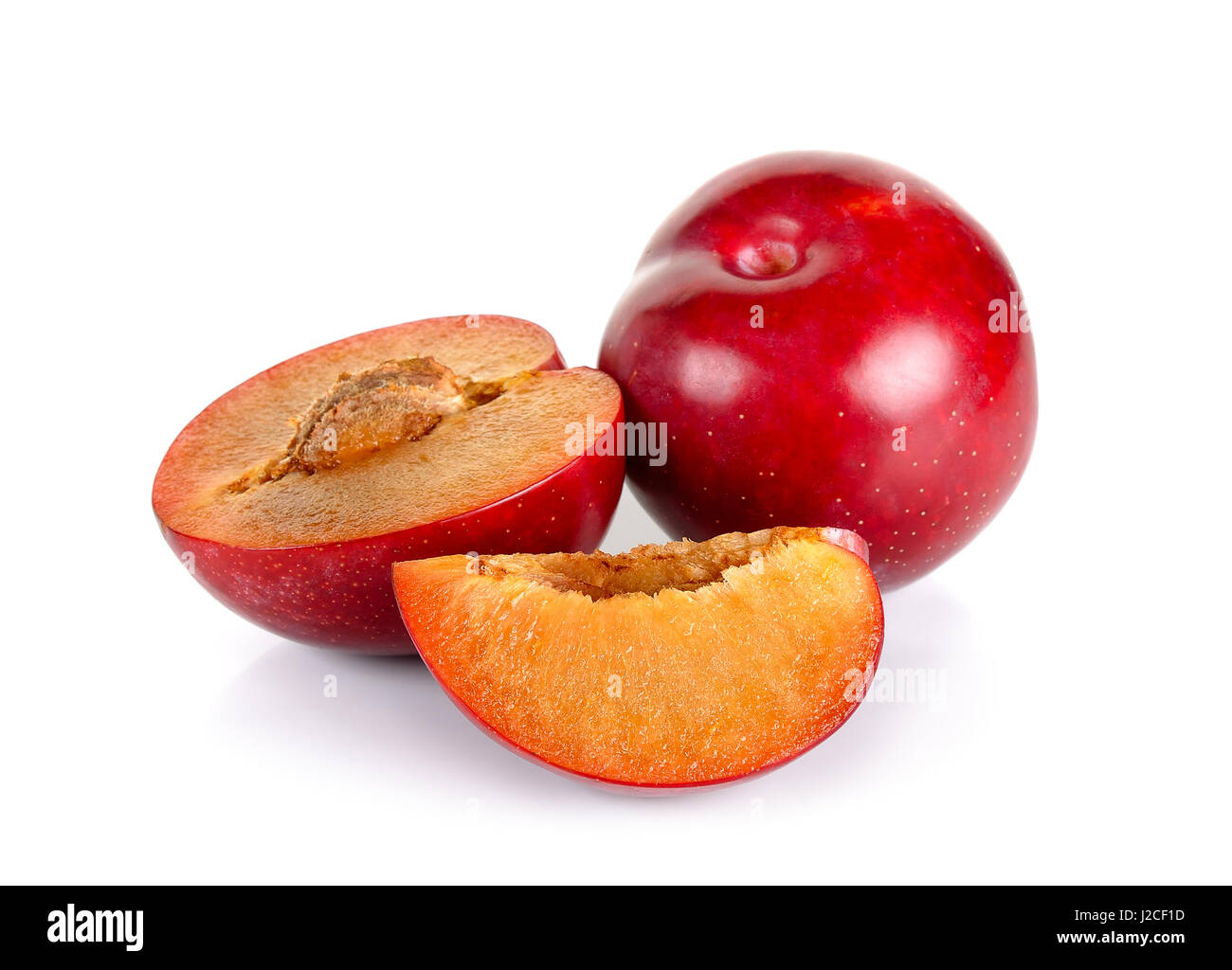 Sliced red plum fruit isolated on white background Stock Photo - Alamy