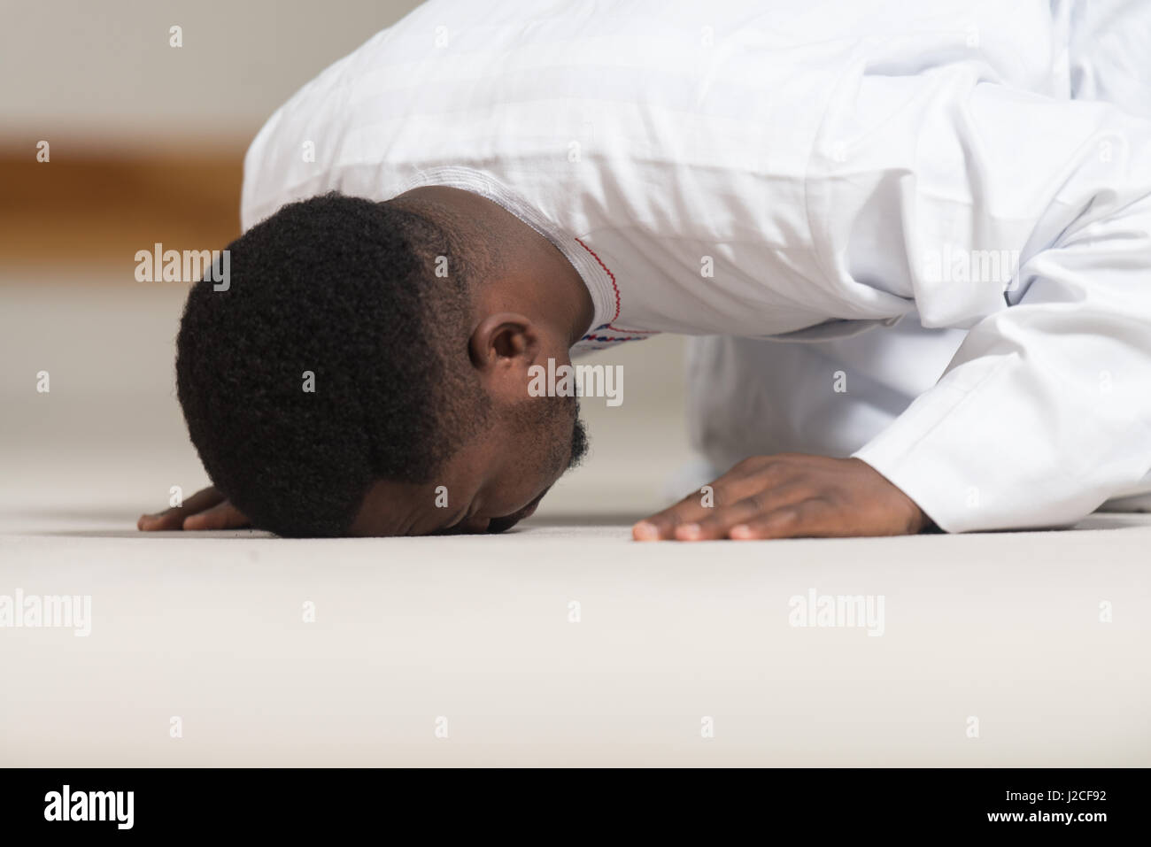 African Muslim Man Making Traditional Prayer To God While Wearing A ...