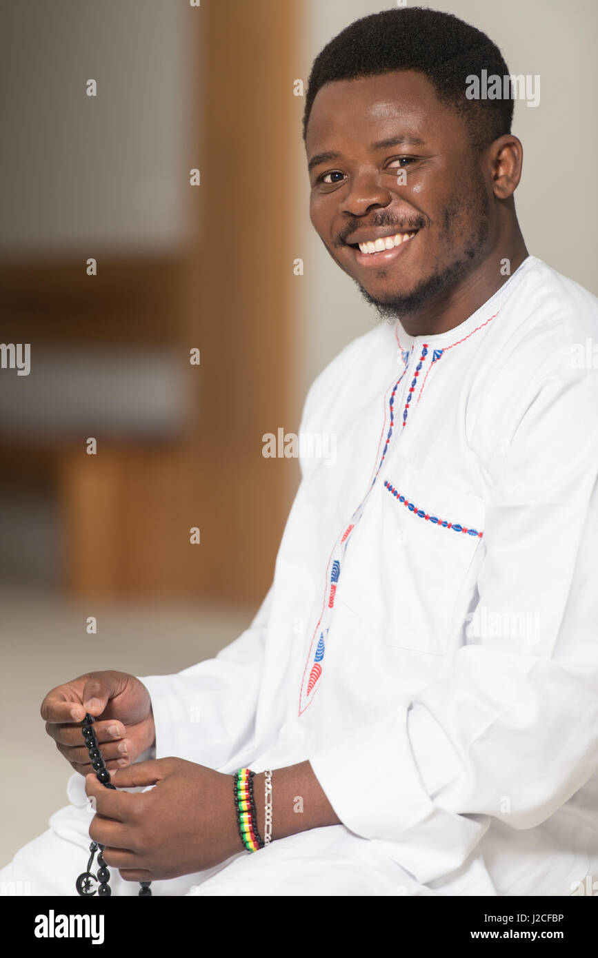 Portrait Of A African Muslim Man Making Traditional Prayer To God While ...
