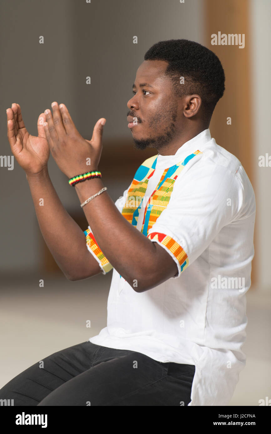Black African Muslim Man Is Praying In The Mosque Stock Photo - Alamy