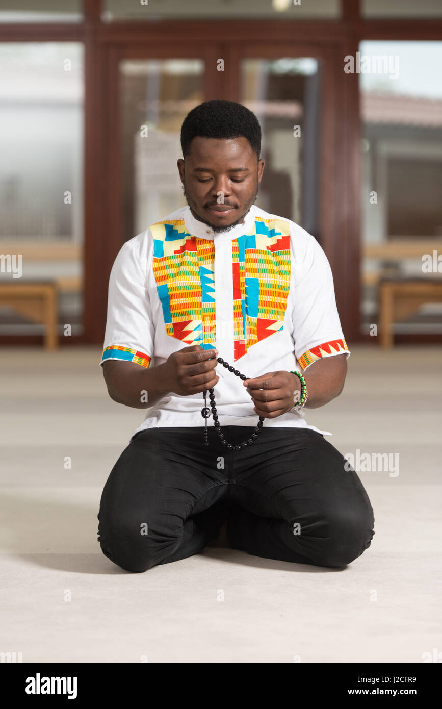 Black African Muslim Man Is Praying In The Mosque Stock Photo - Alamy