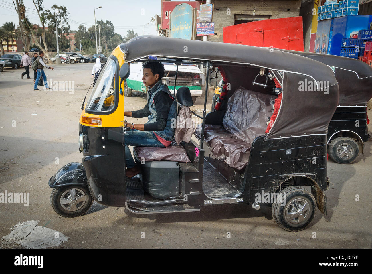 Man sitting in rickshaw in street hi-res stock photography and images ...