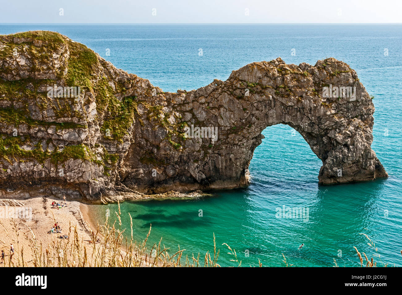 A famous natural rock arch of Portland limestone which rises vertically ...