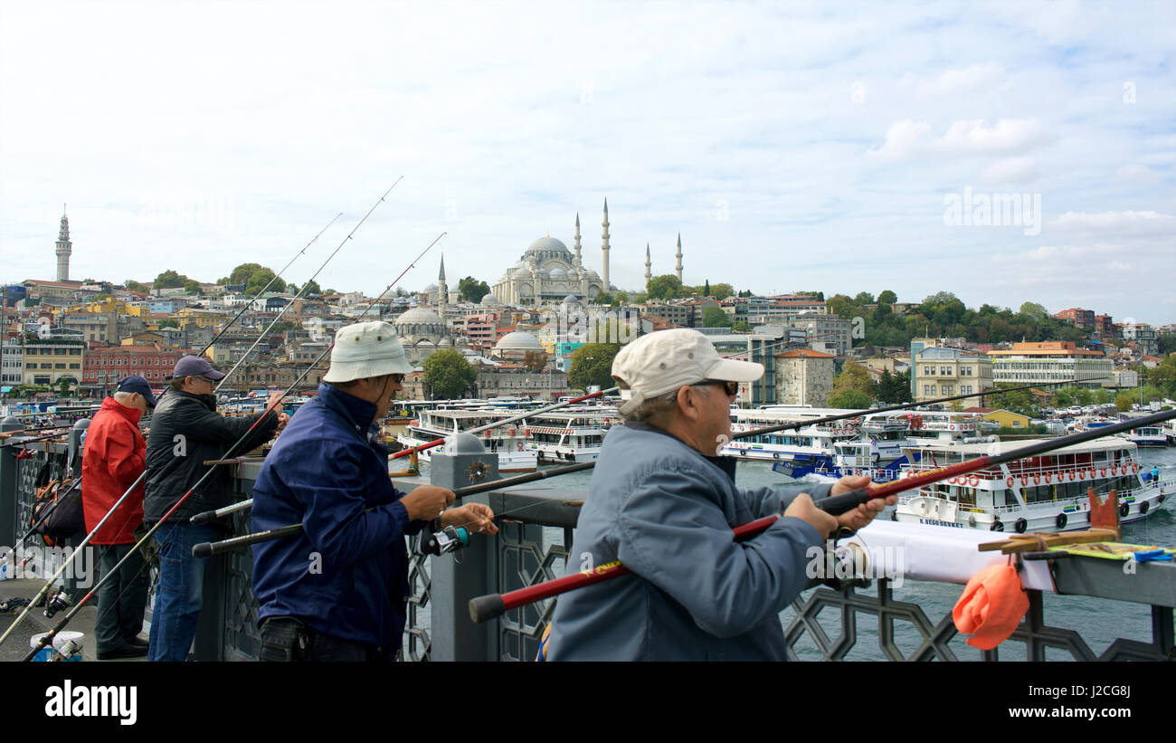 Turkey, Istanbul, fishing from Galata bridge, Suleyman mosque Stock ...