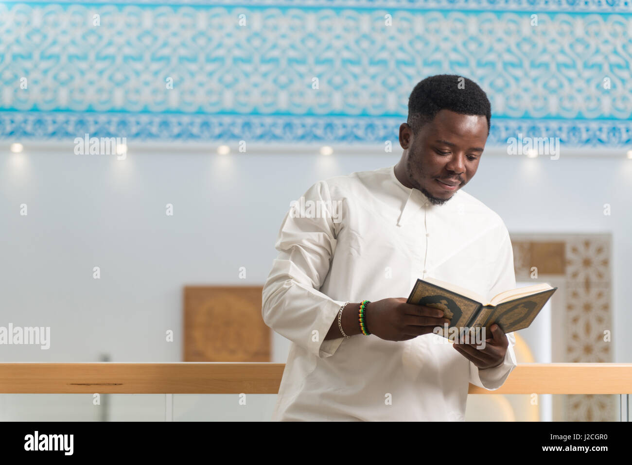 Black African Muslim Man Reading Holy Islamic Book Koran Stock Photo ...