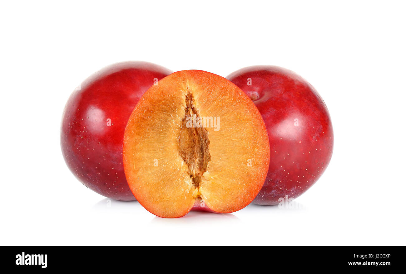 Red plum fruit with half isolated on white background Stock Photo - Alamy