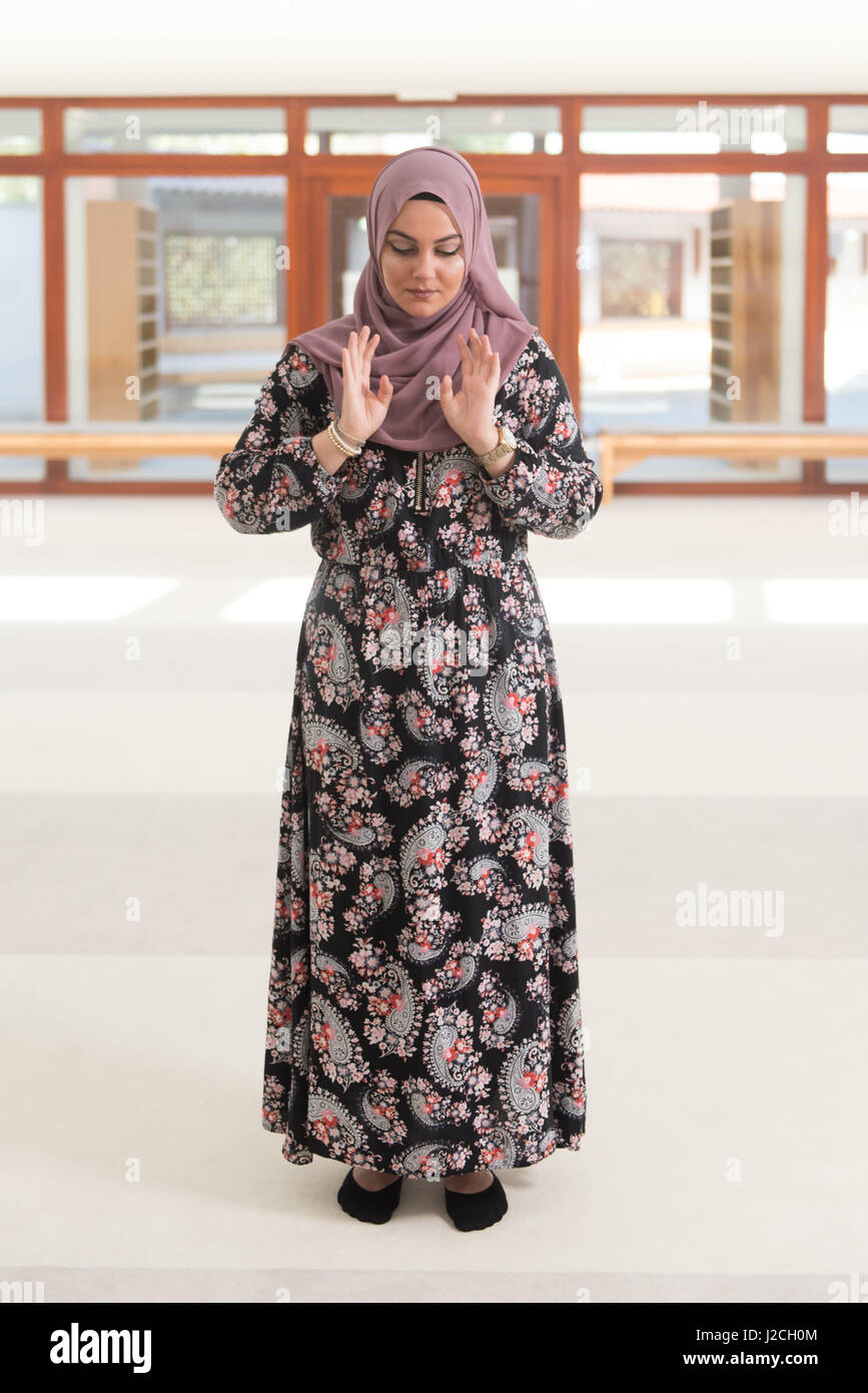 Muslim Woman Making Traditional Prayer To God In Mosque Stock Photo - Alamy