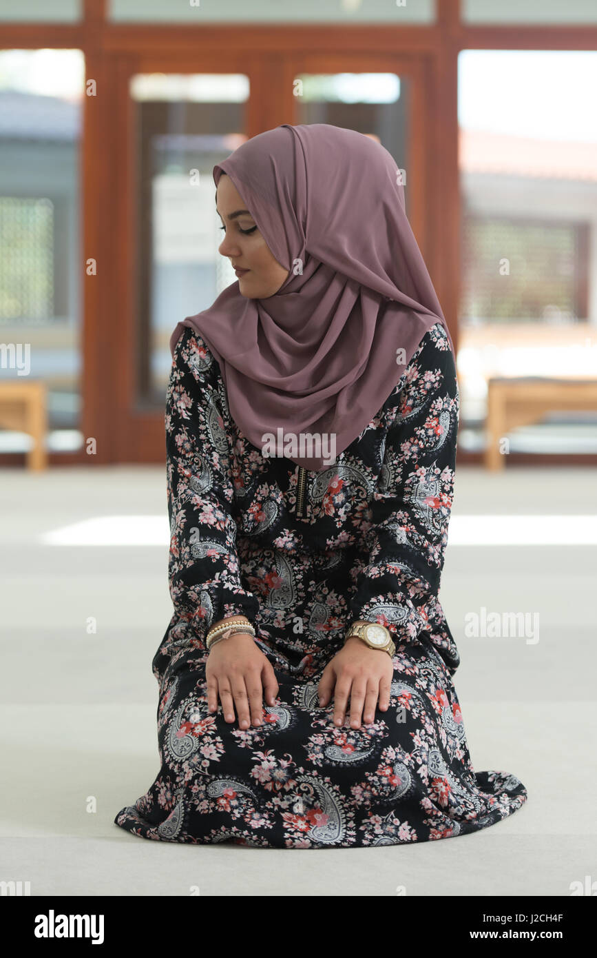 Muslim Woman Making Traditional Prayer To God In Mosque Stock Photo - Alamy