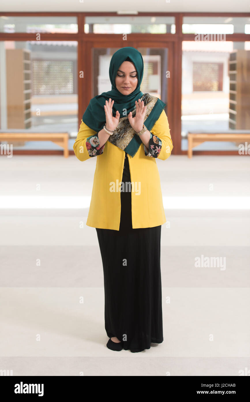 Muslim Woman Making Traditional Prayer To God In Mosque Stock Photo - Alamy