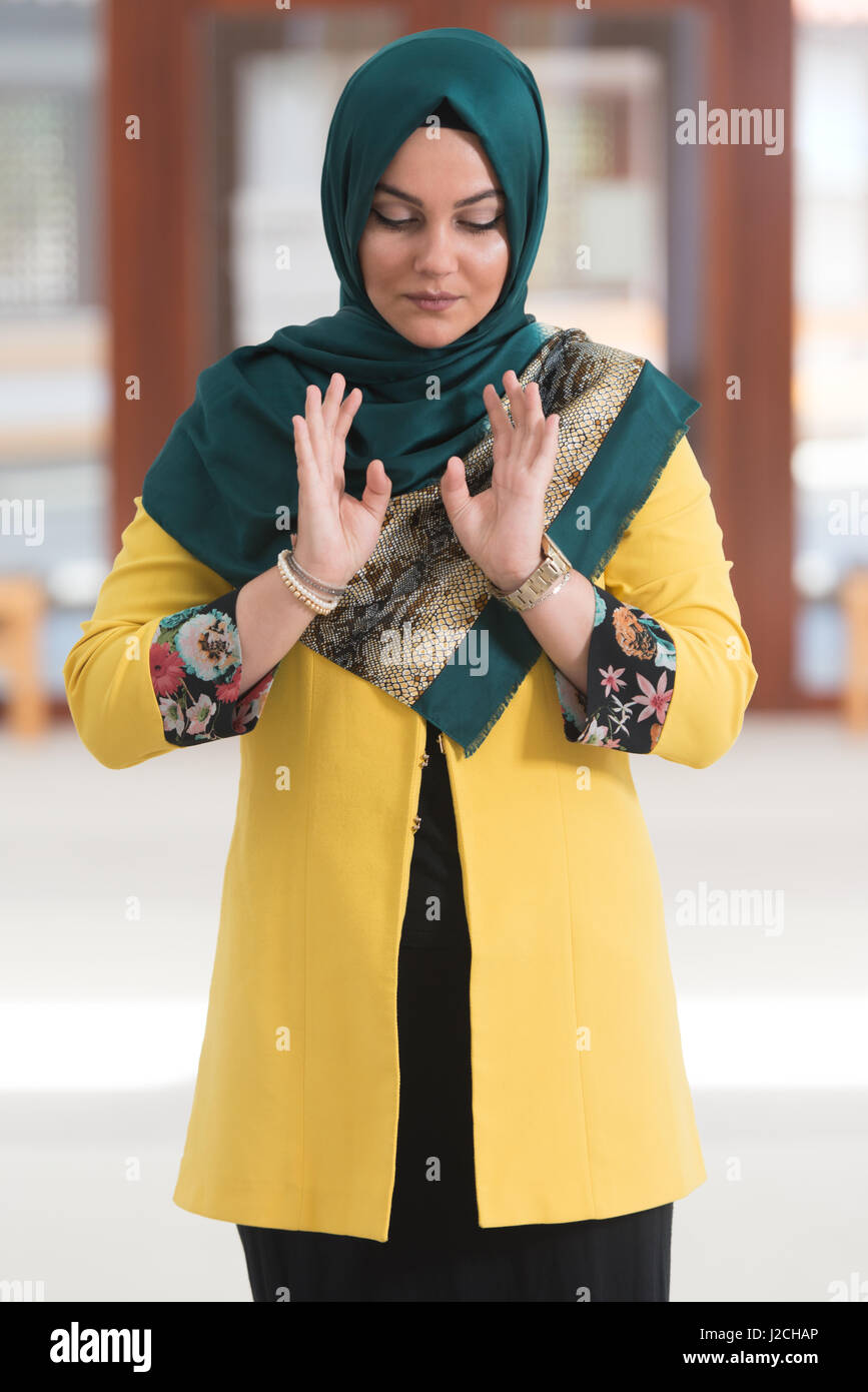 Muslim Woman Making Traditional Prayer To God In Mosque Stock Photo - Alamy