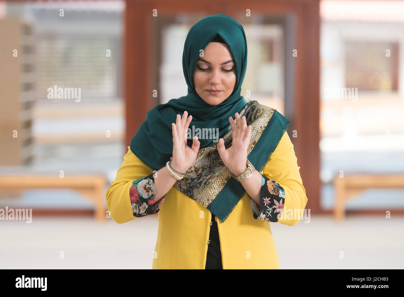 Muslim Woman Making Traditional Prayer To God In Mosque Stock Photo - Alamy