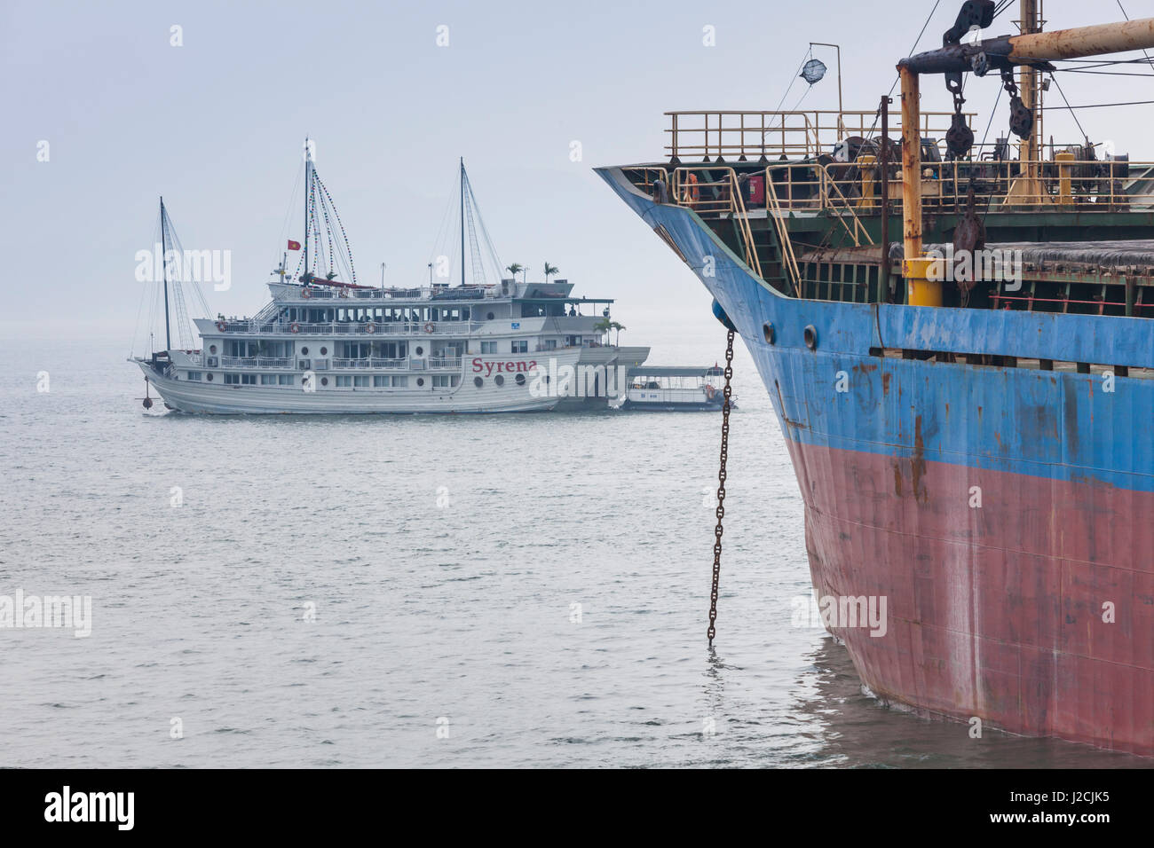 Vietnam, Halong City, Halong Bay cargo ship Stock Photo - Alamy